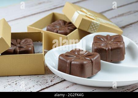 Brazilian honey cakes on a plate and inside golden gift boxes Stock ...