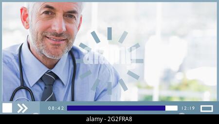 Composition of male doctor smiling on video playback interface screen ...