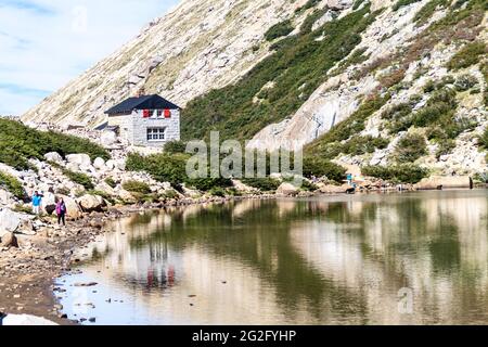 Mountain hut Refugio Frey and Laguna Toncek lake near Bariloche ...