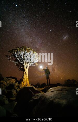 Lighting the night sky in namibia Stock Photo - Alamy