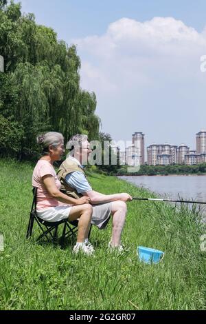 Old couple fishing by the lake high quality photo Stock Photo - Alamy