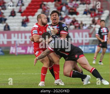 Adam Quinlan (1) of Hull KR is tackled by Reece Lyne (4) and Mason Lino ...