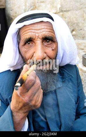 Portrait of a man smoking a cigarette. Palestinian Refugee Camps of ...