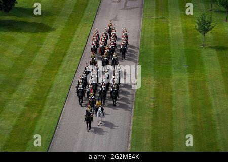 Members of the Household Cavalry arrive at Windsor Castle ahead of a ...