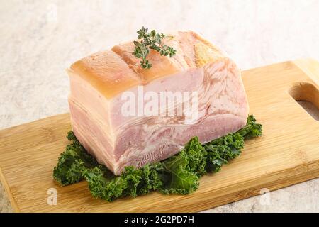 Cut of homemade pork bacon over board Stock Photo - Alamy