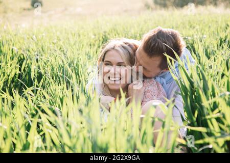 Couple of farmers in field holding milk bottles Stock Photo - Alamy