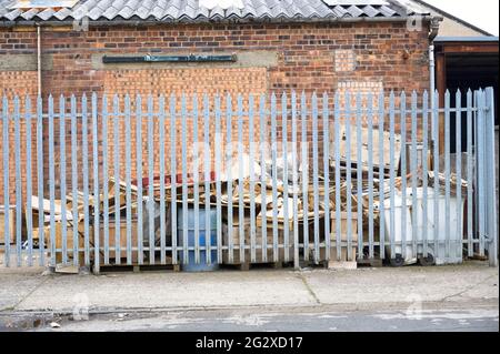 Cardboard and rubbish in waste compound for disposal at dump site Stock ...