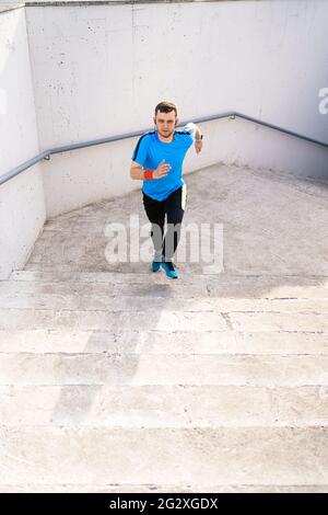 young man running upstairs Stock Photo - Alamy