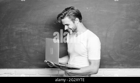 Student learn programming language. Handsome man use modern technology ...