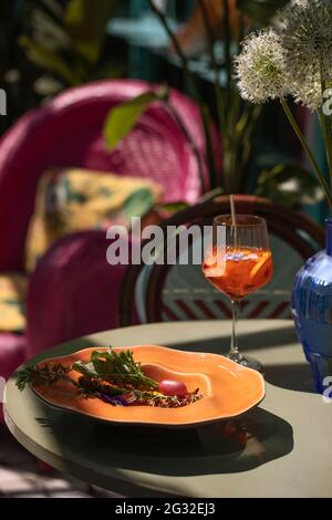Grilled octopus leg with grilled vegetables with leaves and summer ...
