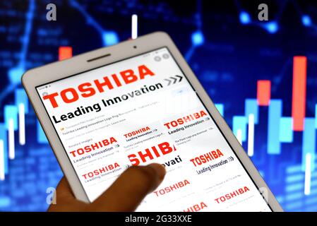 In this Photo illustration the Toshiba Logos seen displayed on an ...