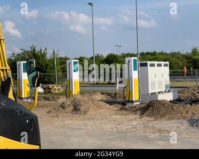 Charging columns for electric vehicles are installed on the premises of ...