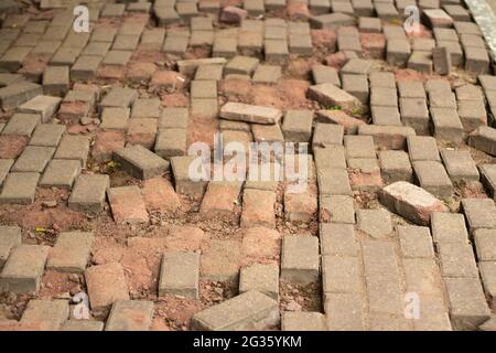 pedestrian tiles broken Stock Photo - Alamy