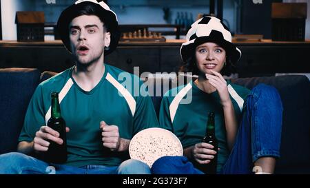 woman in hat with bucket of popcorn showing Ok gesture Stock Photo - Alamy