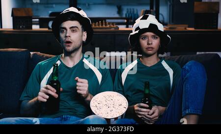 woman in hat with bucket of popcorn showing Ok gesture Stock Photo - Alamy