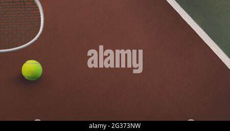 Composition of tennis ball and racket with copy space on tennis court ...