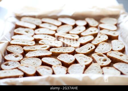 fresh crisp bread on baking sheet on a table Stock Photo - Alamy
