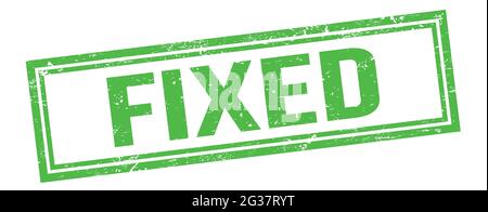 FIXED text on green grungy rectangle stamp sign Stock Photo - Alamy