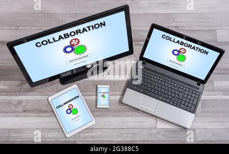 Collaboration concept shown on different information technology devices ...