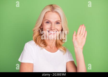 Photo of adorable funny lady pensioner wear white t-shirt sitting sofa ...