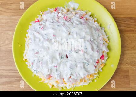 The process of making a delicious salad of crab sticks, carrots, smoked ...