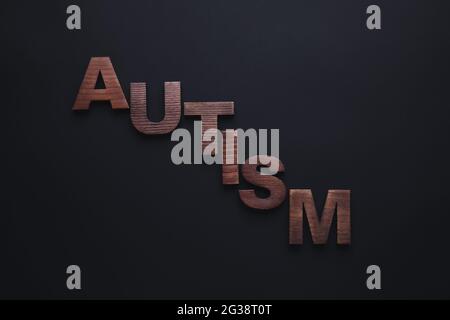 Word AUTISM on dark background Stock Photo - Alamy