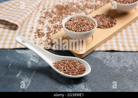 Composition with flax seeds on color wooden table Stock Photo - Alamy