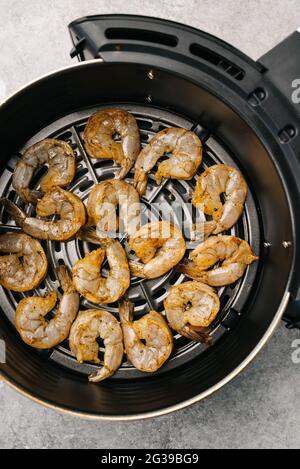 Raw fresh shrimp marinated in fish sauce and garlic served on metal ...