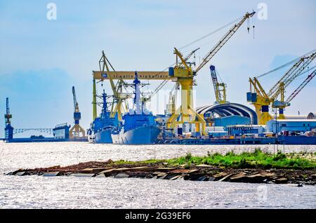 Military warships are under construction at Ingalls Shipbuilding, a ...