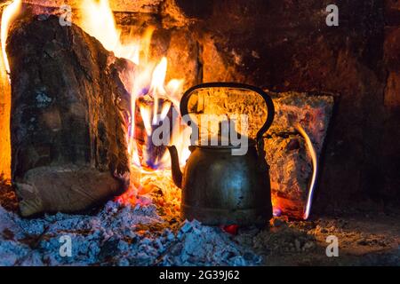 kettle on the firewood to heat the mate water in the Argentine ...