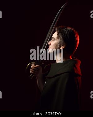 Soldier of past times standing sideways with his rifle slung over his ...