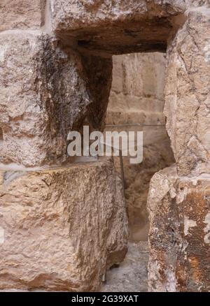 Eye of a needle a gate in Jerusalem. Bible story: Matthew 19,16-24 ...