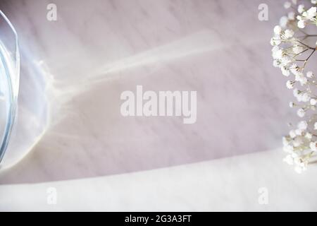Elegant delicate background with natural sunbeam on marble surface ...