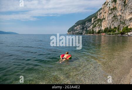 Tignale, Italy. 14th June, 2021. Small boats lie in the shade of a ...