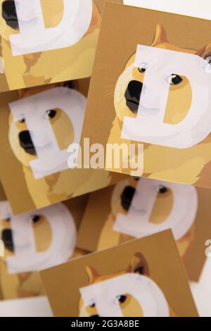 LONDON, UK - June 2021: Doge or dogecoin cryptocurrency logo on paper ...