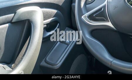 Lower car window buttons with control panel close up view Stock Photo ...