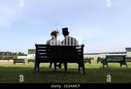 Racegoers on a bench during day one of Royal Ascot at Ascot Racecourse ...