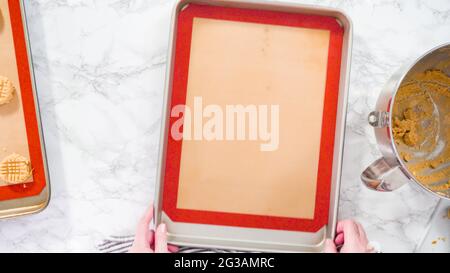Flat lay. Step by step. Scooping peanut butter cookies dough with dough ...