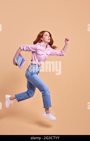 Young redhead student woman wearing graduated uniform very happy and ...
