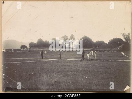 Men and children on a lawn at Fort Nieuw Victoria on Ambon, Anonymous ...