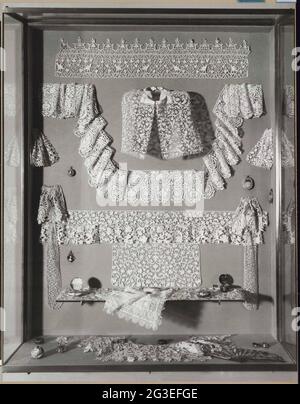 Room with lace objects in showcases; Lace arrangement Stock Photo - Alamy