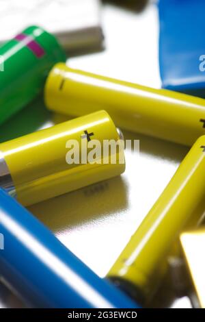 Many batteries on a metal table Stock Photo - Alamy