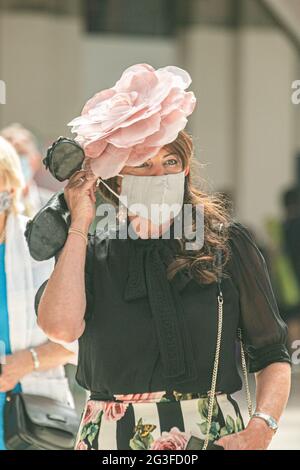 Ascot, Berkshire, UK. 16 June 2026. A racegoer wearing an elaborate hat ...