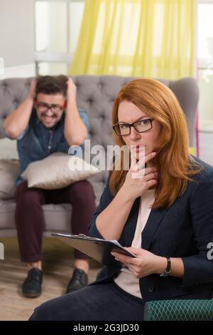 Handsome man at the psychotherapist Stock Photo - Alamy