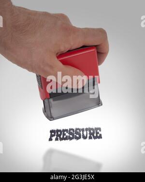 Plastic stamp in hand, Pressure Stock Photo - Alamy