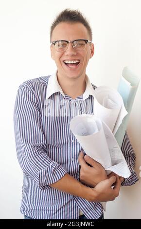 Portrait of expert with blueprints Stock Photo - Alamy