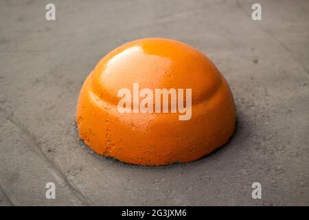 Parking spherical vehicle movement blocker. Orange traffic limiter ...