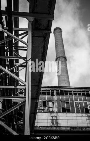 Grayscale shot of an old abandoned factory with broken objects Stock ...