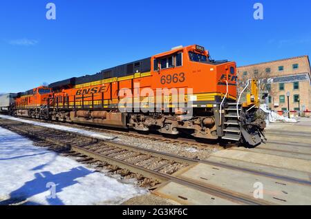 Naperville, Illinois, USA. Two Burlington Northern Santa Fe locomotives lead an intermodal ...
