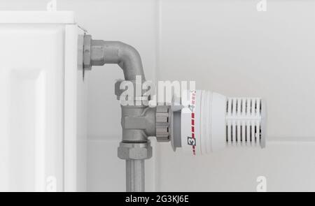 Temperature knob of heating radiator, used and dusty Stock Photo - Alamy